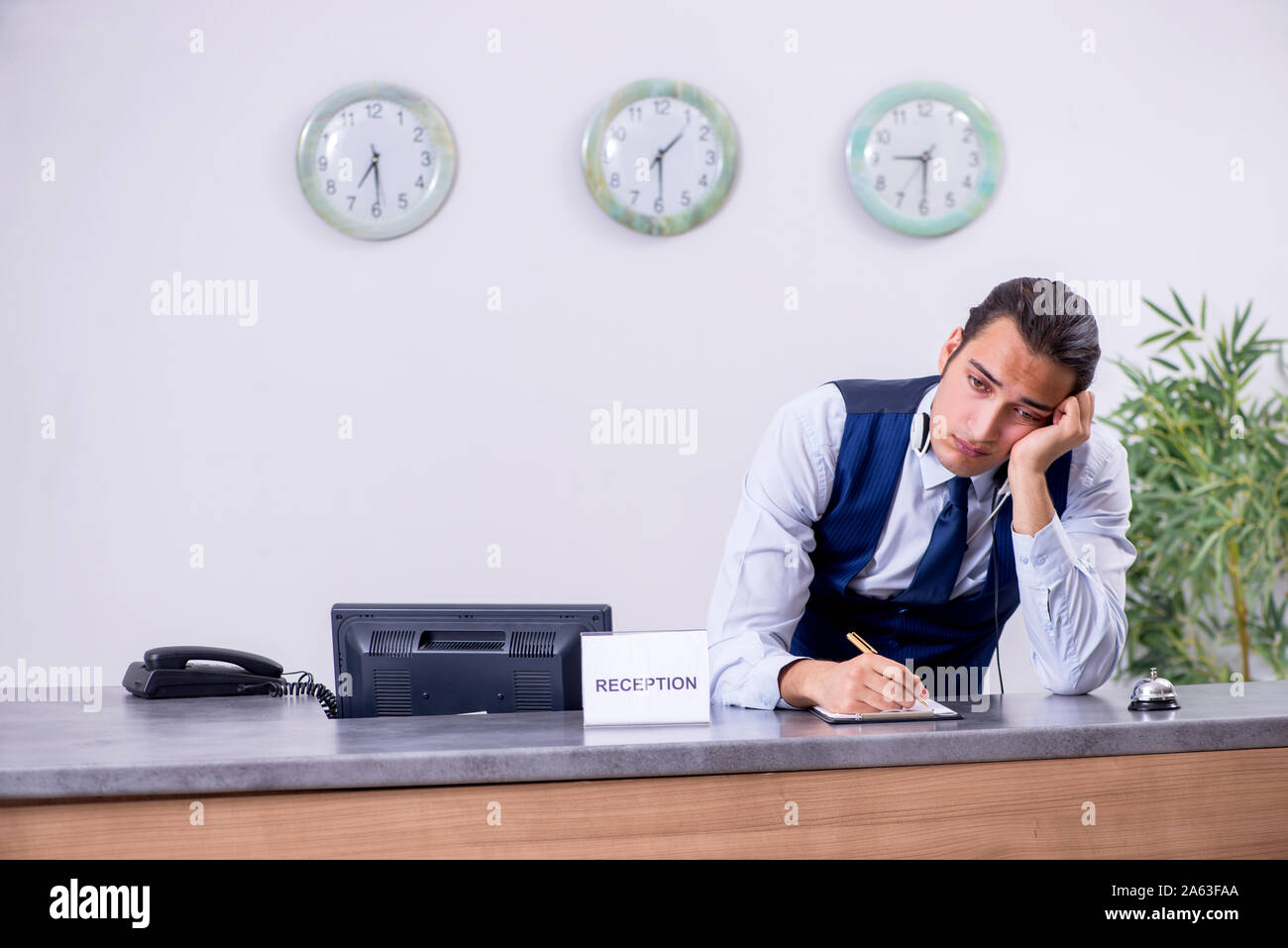 Tired hotel staff hi-res stock photography and images - Alamy