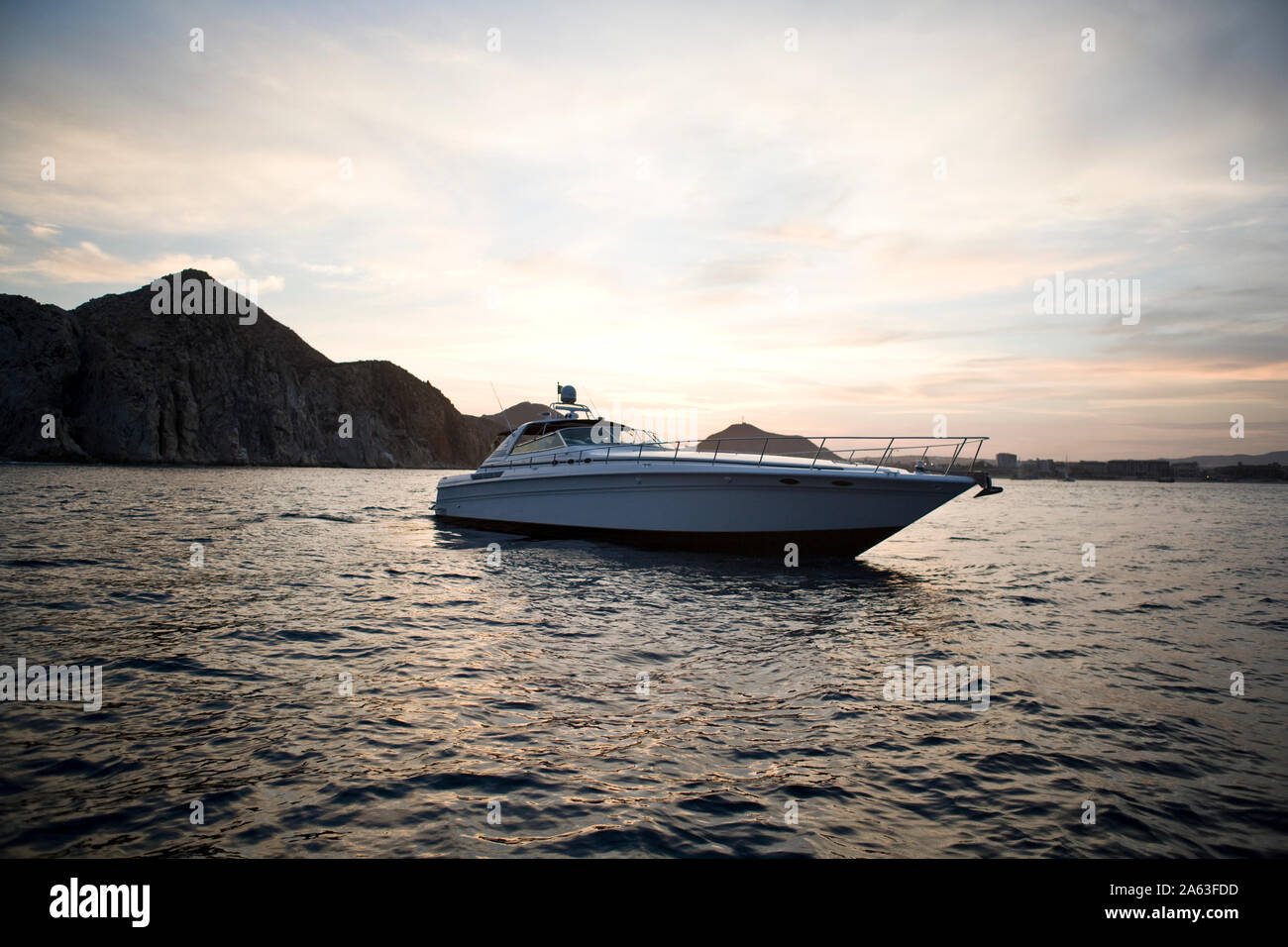 Boat sailing in a bay Stock Photo - Alamy