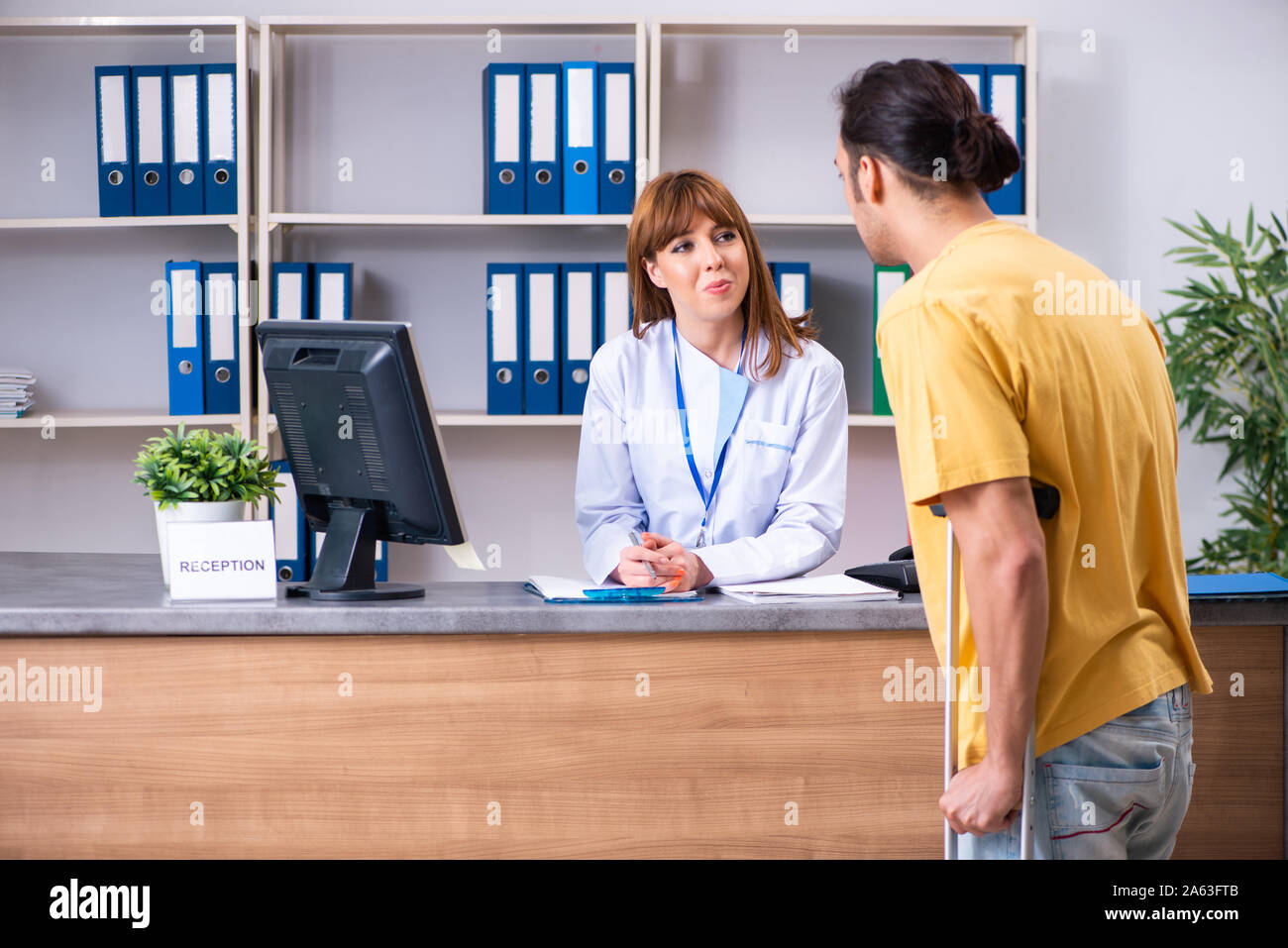 The young patient at the reception in the hospital Stock Photo - Alamy