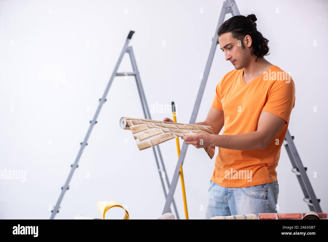 Young man contractor doing renovation hi-res stock photography and ...