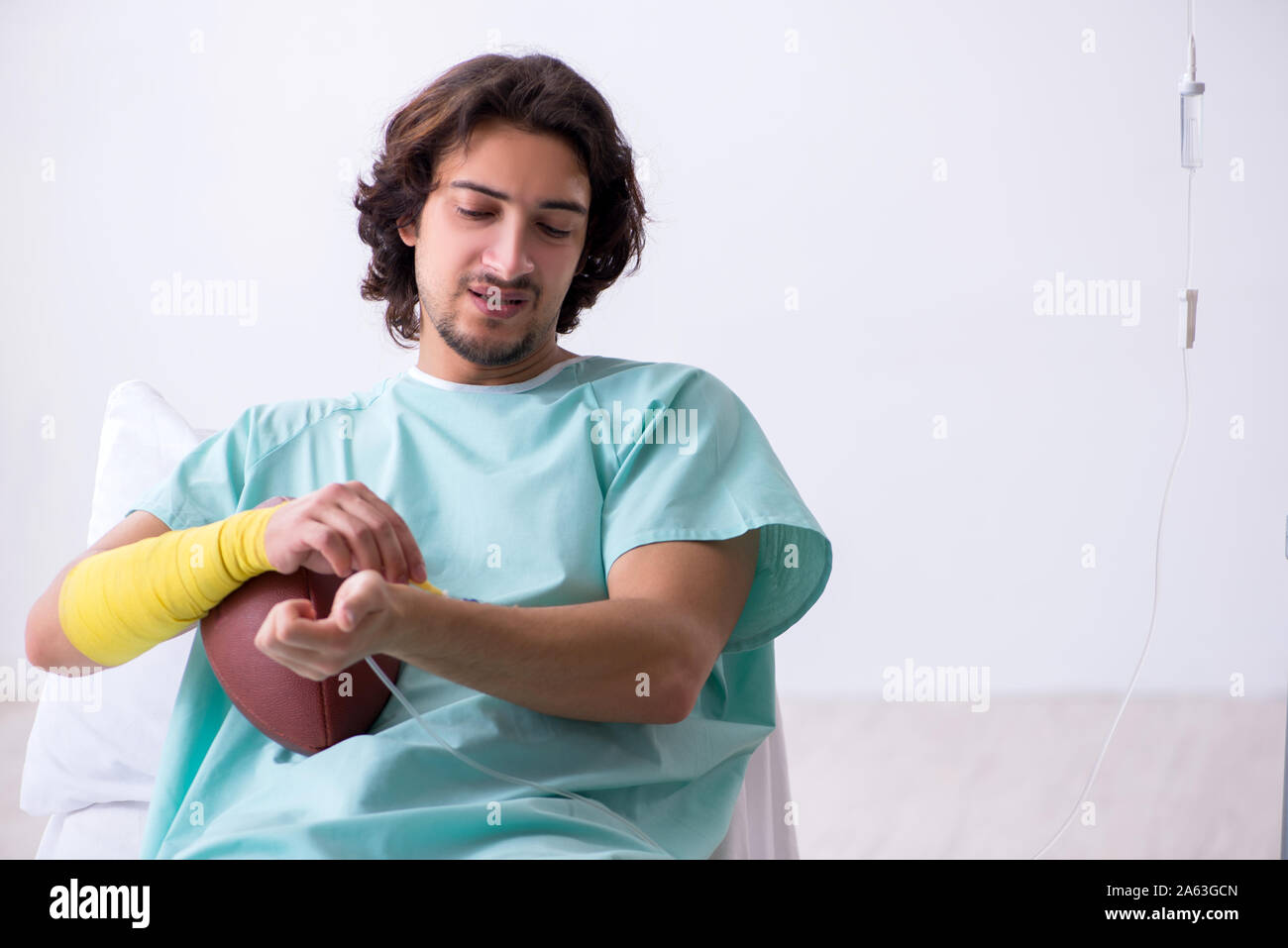 The young man staying in hospital in transfusion concept Stock Photo ...