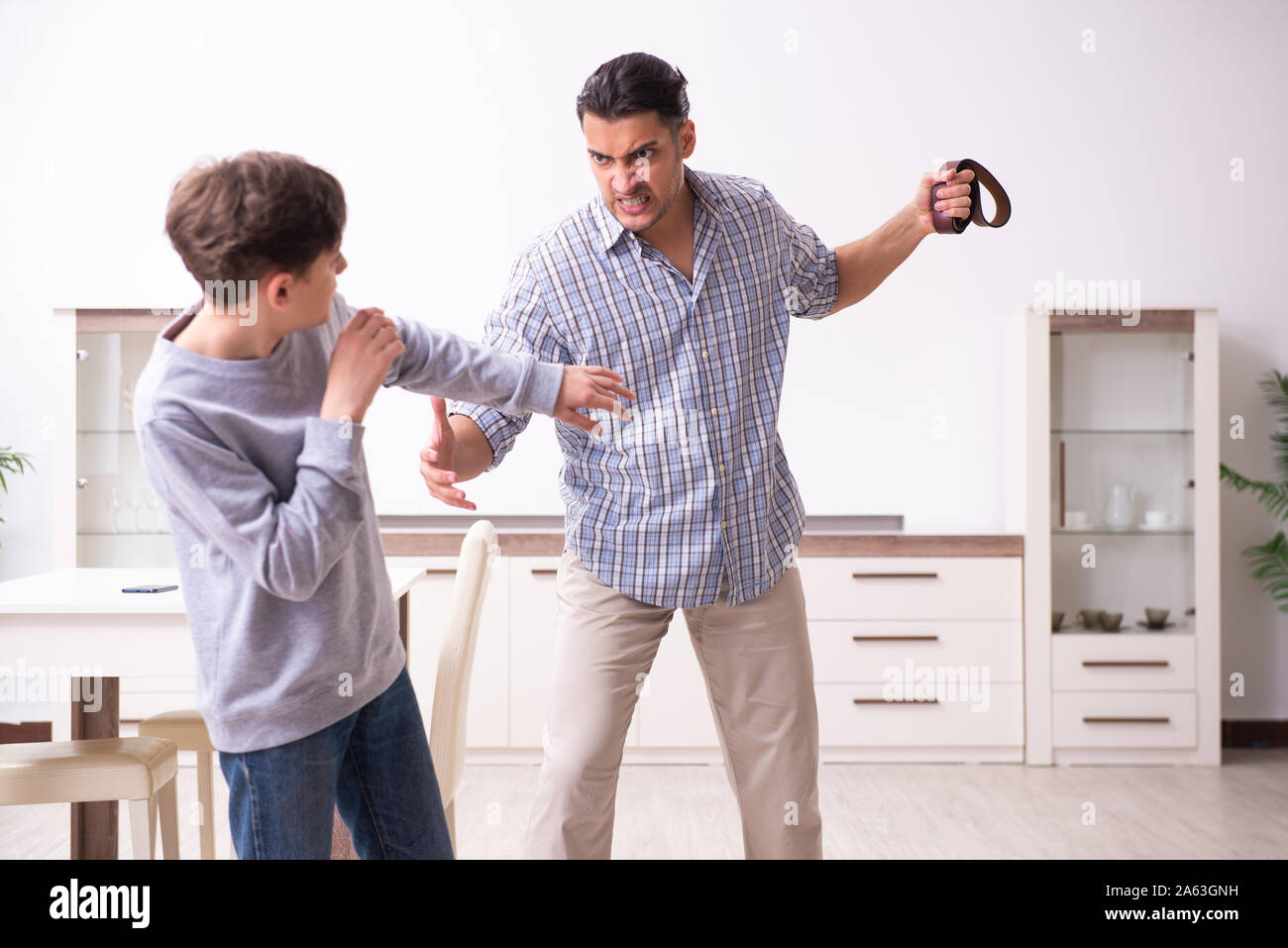 The father beating and punishing his sone Stock Photo - Alamy