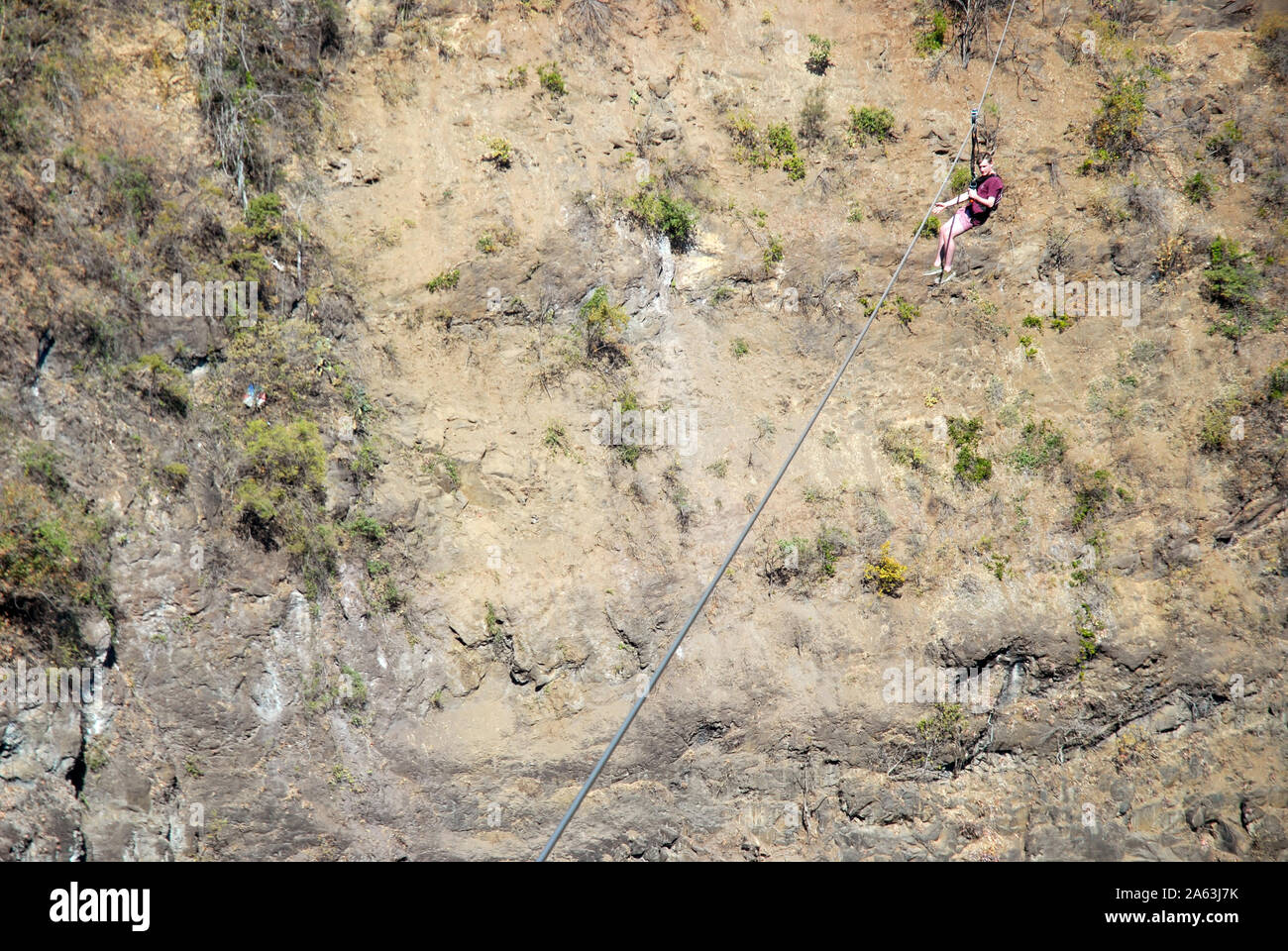Zipline from the Victoria Falls Bridge over the Zambezi River, Zimbabwe ...