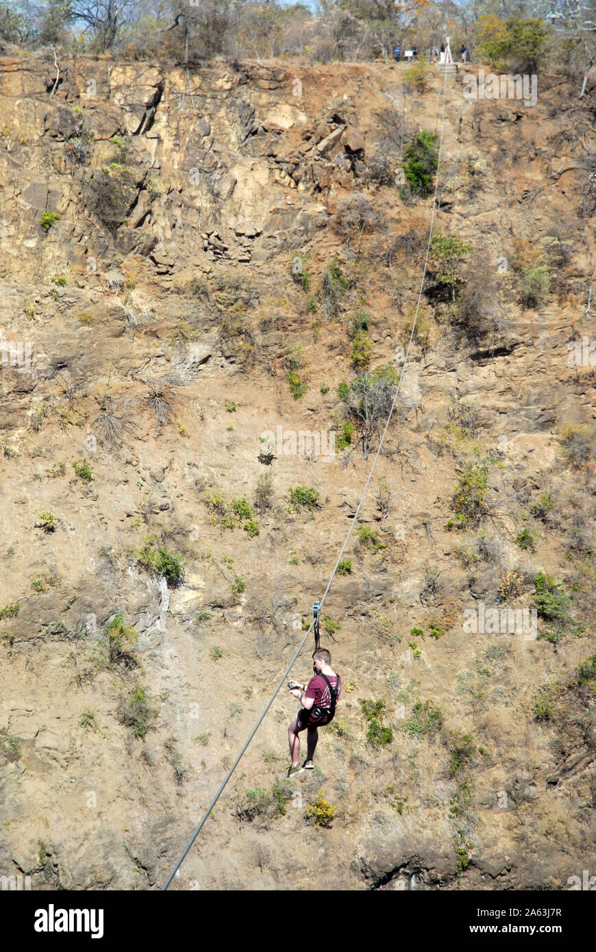 Zipline from the Victoria Falls Bridge over the Zambezi River, Zimbabwe ...