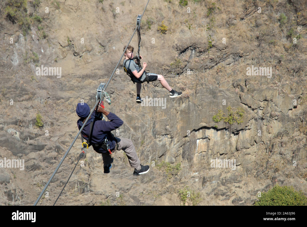 Zipline from the Victoria Falls Bridge over the Zambezi River, Zimbabwe ...