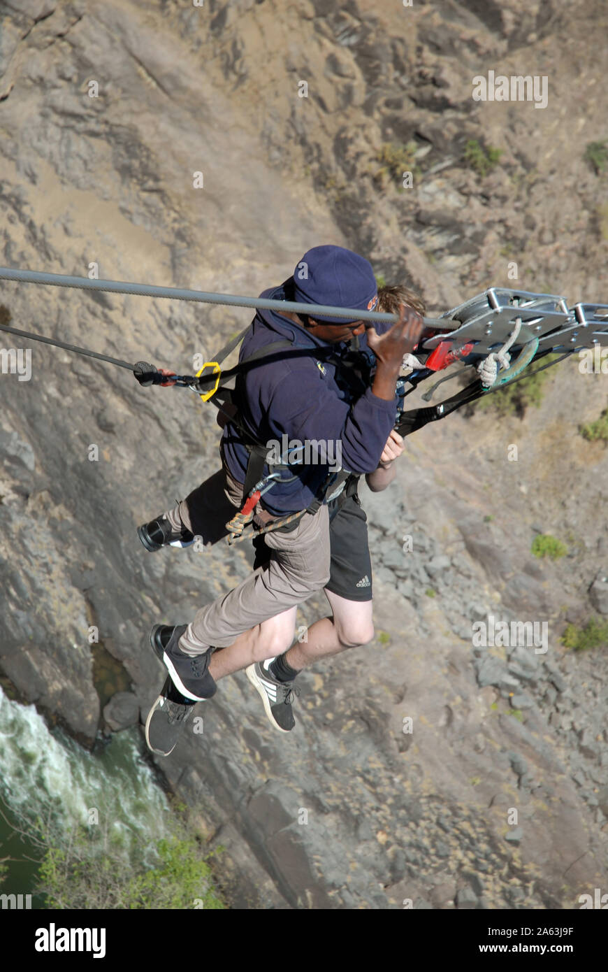 Zipline from the Victoria Falls Bridge over the Zambezi River, Zimbabwe ...