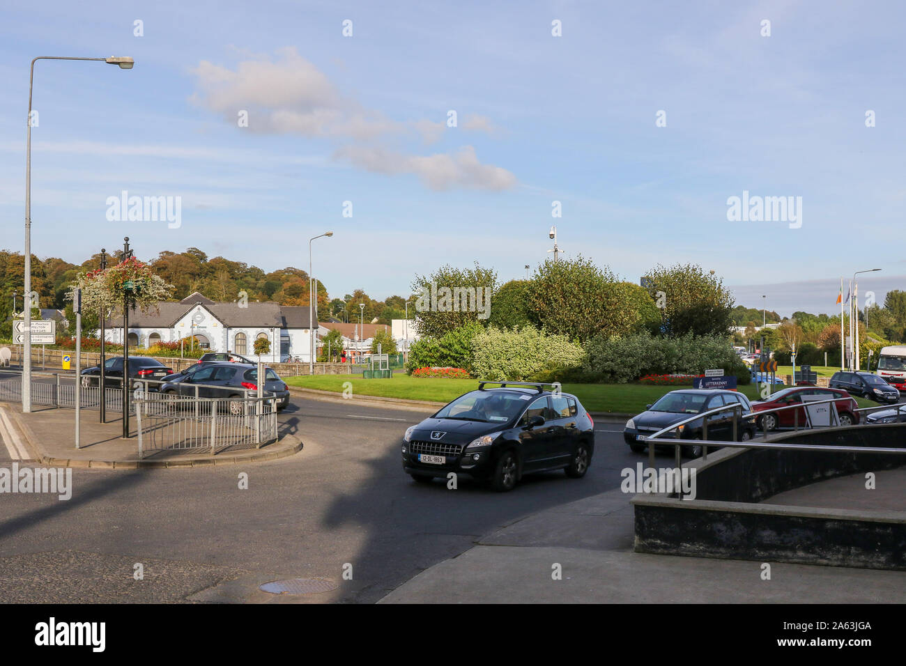 road traffic in County Donegal with cars at Station Road roundabout in ...