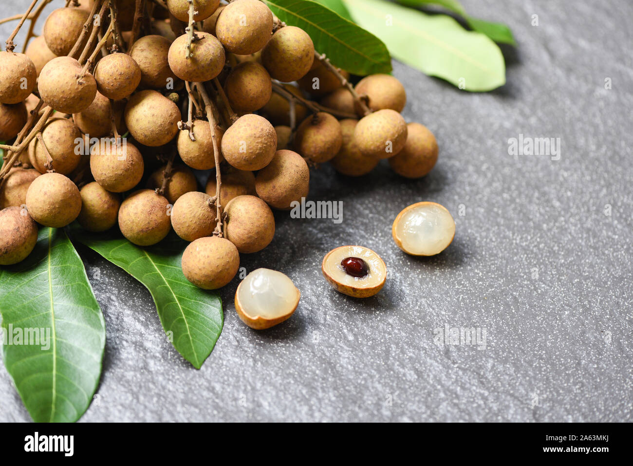Longan fresh tropical fruit and green leaf in Thailand / Dimocarpus ...