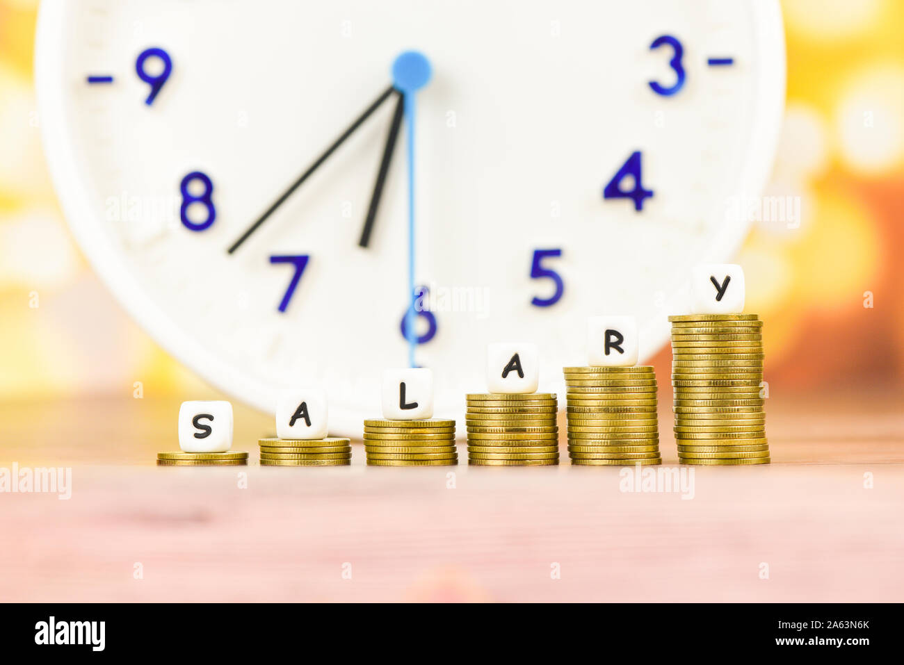 Payroll and salaries ladder increase growth money coins on table and ...