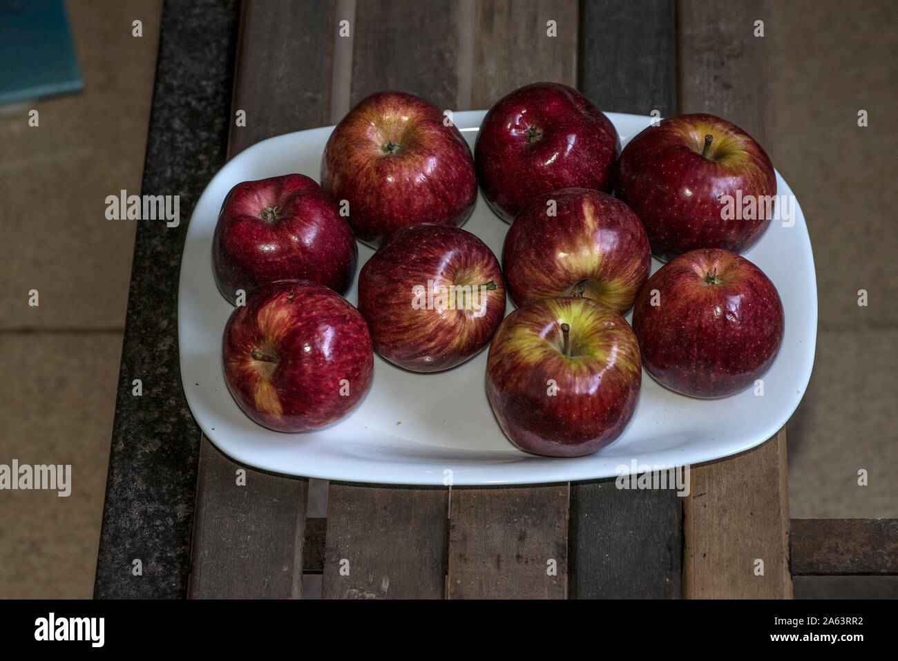 Red delicious apples on a white tray Stock Photo - Alamy