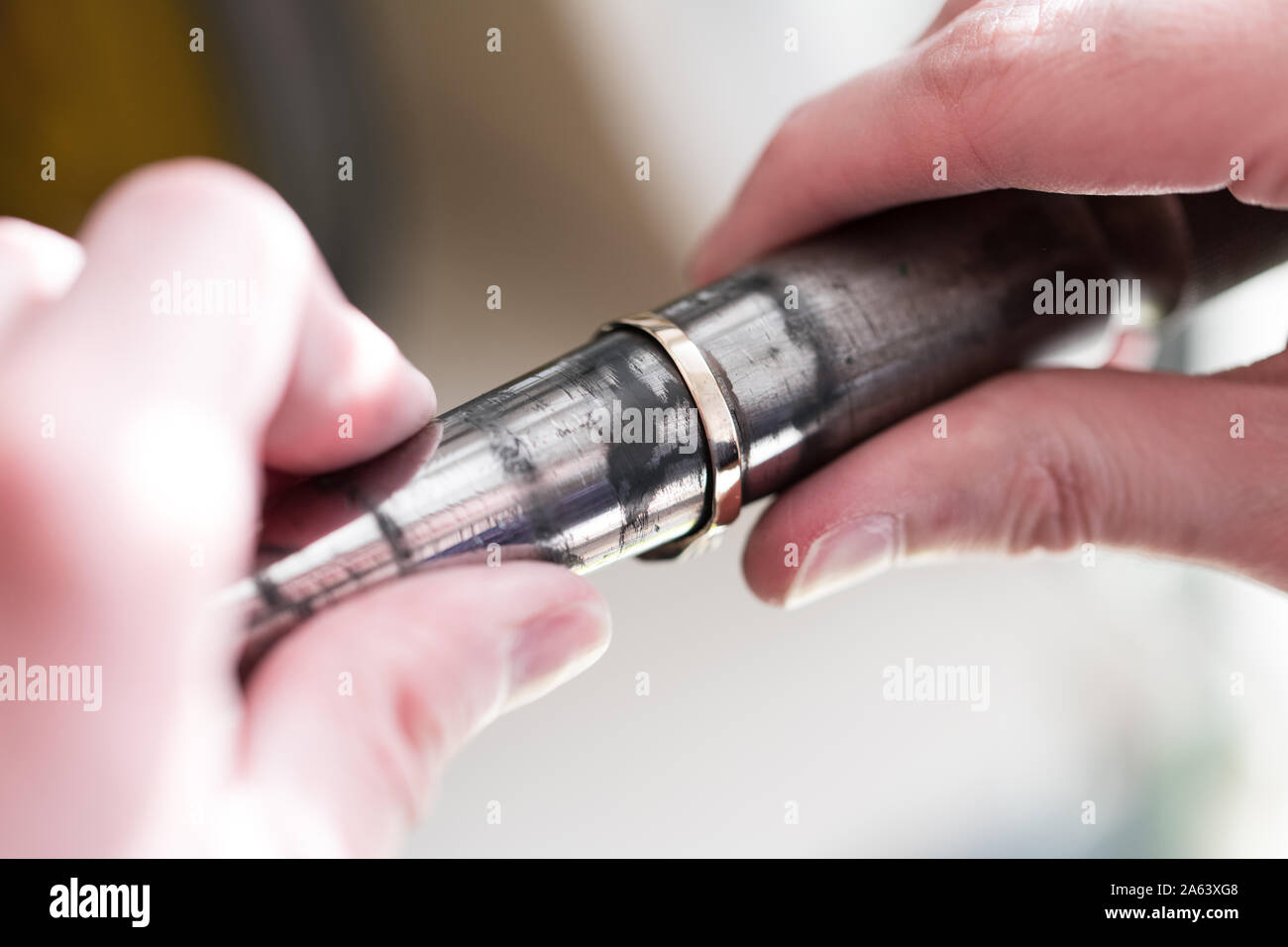 Jeweler Polishing A Gold Ring At Workbench - Goldsmith Making A Ring At ...