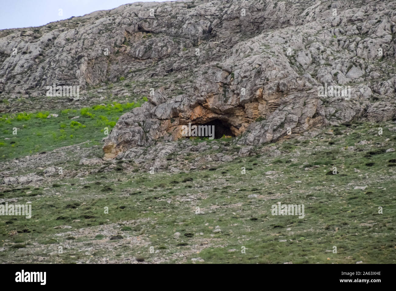 Caves in the limestone mountains. Void in the rock mountain Stock Photo ...