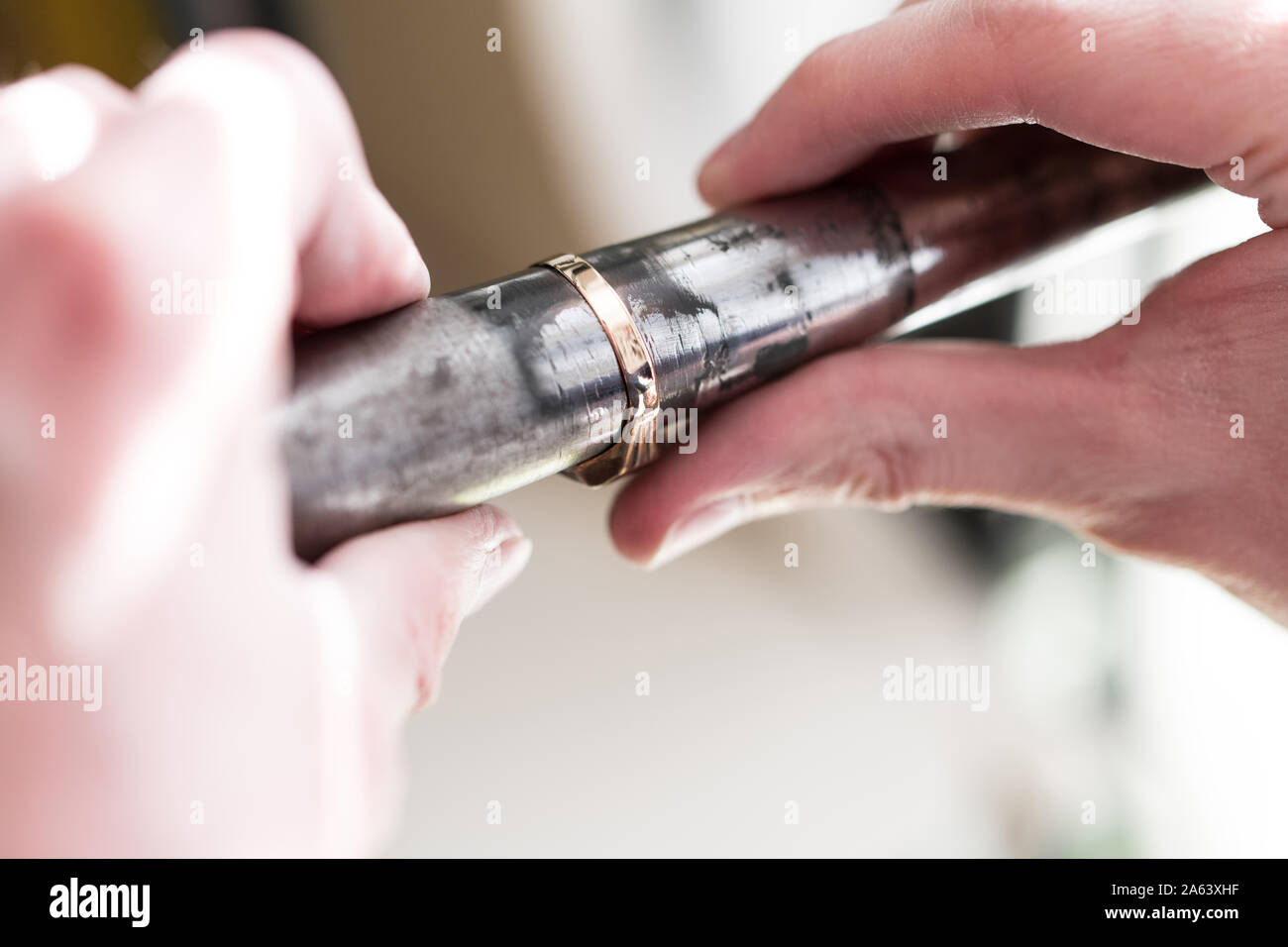 Jeweler Polishing A Gold Ring At Workbench - Goldsmith Making A Ring At ...