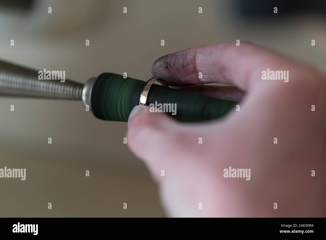 Jeweler Polishing A Gold Ring At Workbench - Goldsmith Making A Ring At ...
