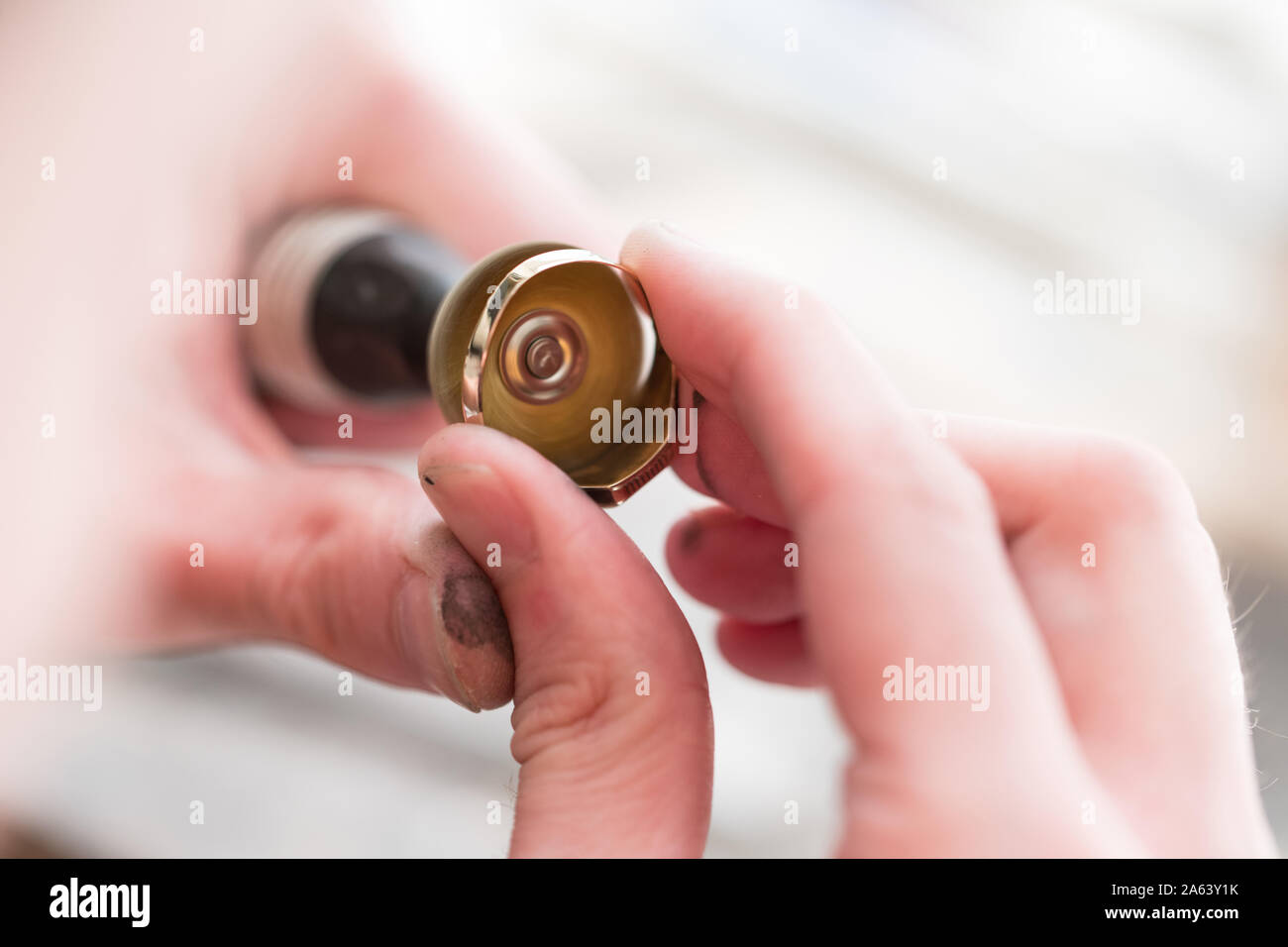 Jeweler Polishing A Gold Ring At Workbench - Goldsmith Making A Ring At ...
