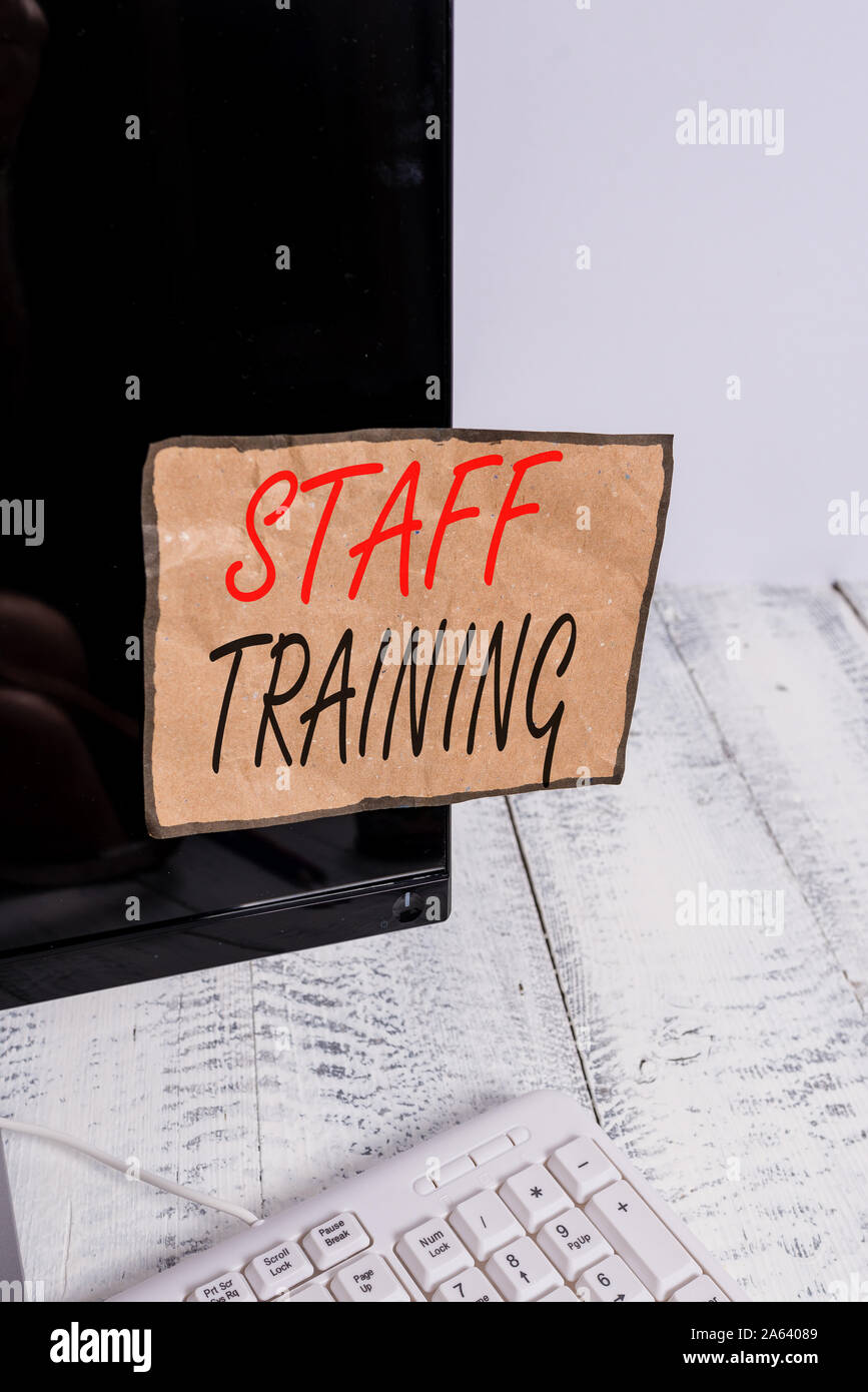 Writing note showing Staff Training. Business concept for program that ...