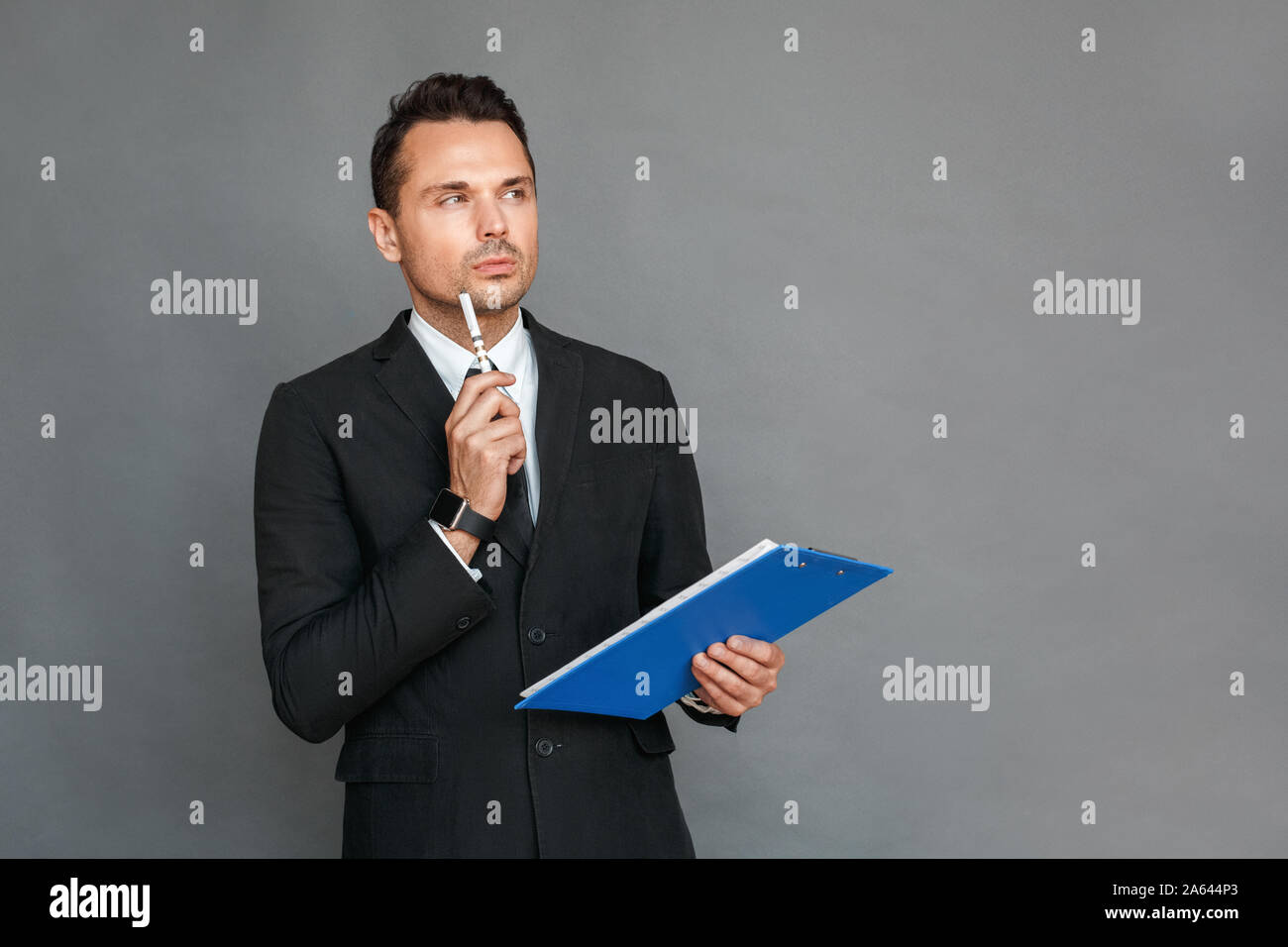 Salesman thinking pen paper work hi-res stock photography and images ...
