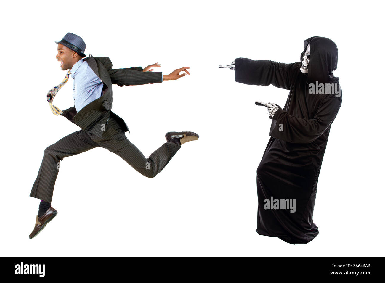 Man in a grim reaper halloween ghost costume having fun and scaring a ...