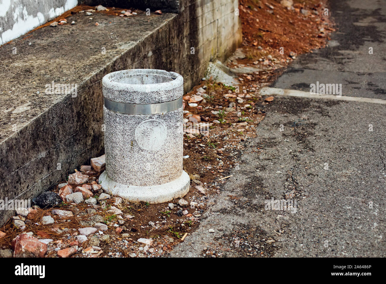 Gray concrete or stone trash can on street Stock Photo - Alamy