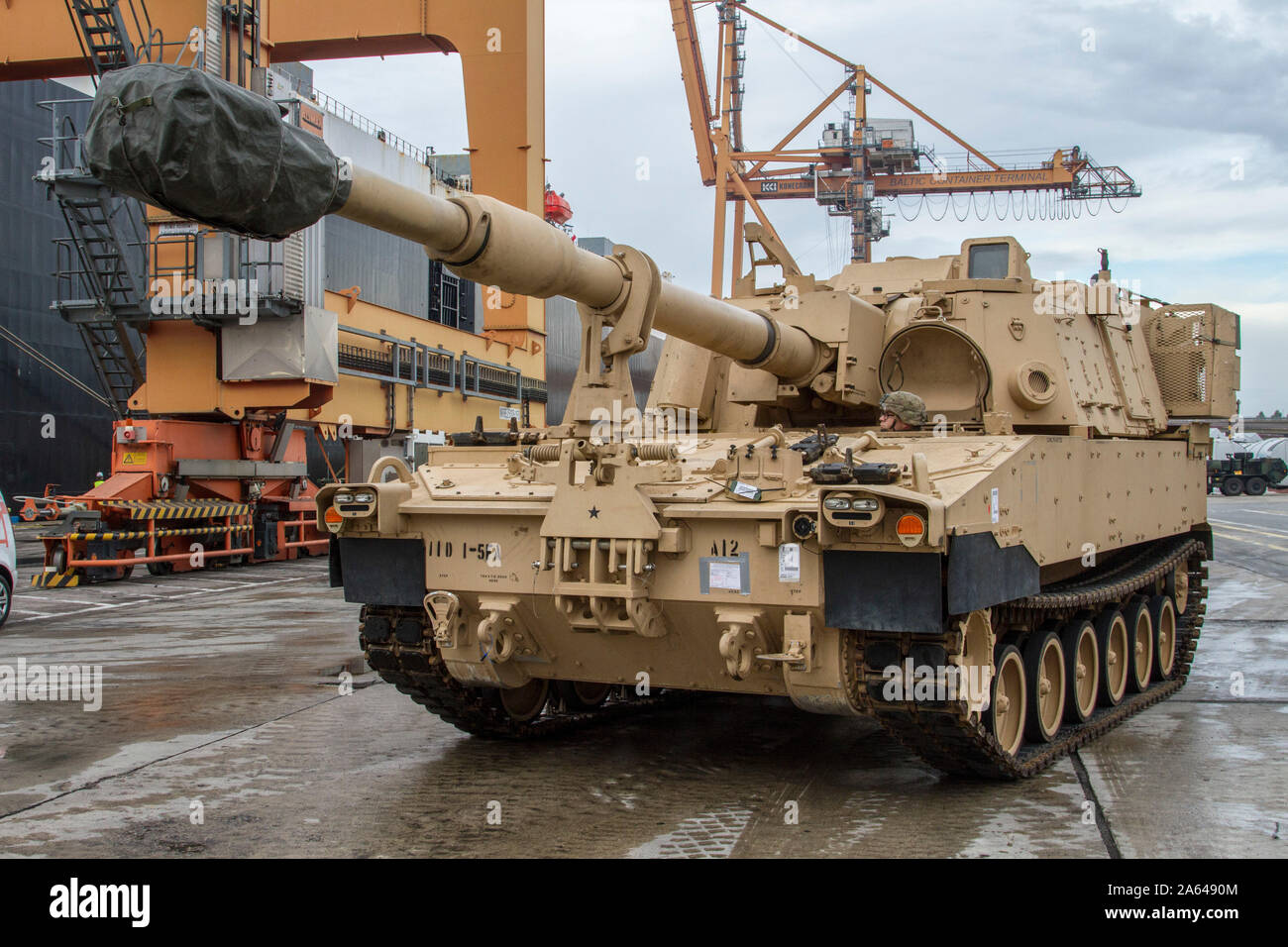 A Soldier operating an M109A6 "Paladin" belonging to 1st Battalion, 5th ...