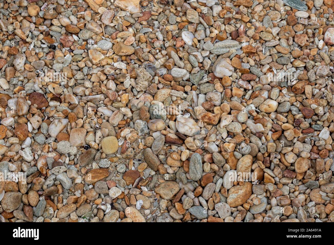 Small stones on the ground Stock Photo - Alamy