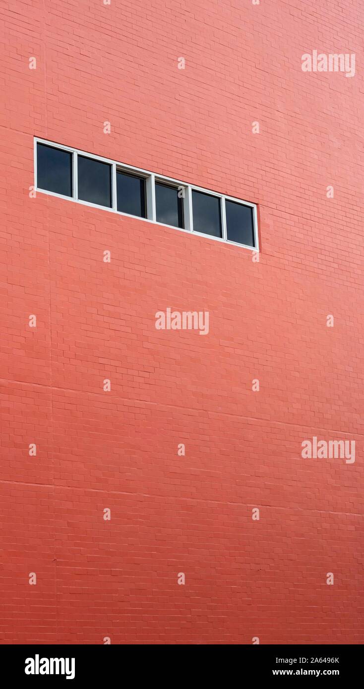 Red tall buildings with Windows Stock Photo - Alamy
