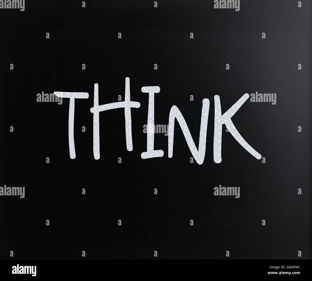 The word "Think" handwritten with white chalk on a blackboard Stock ...