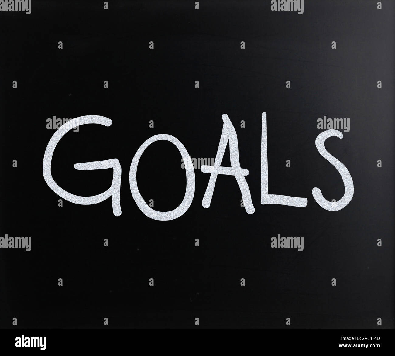 The word "Goals" handwritten with white chalk on a blackboard Stock ...
