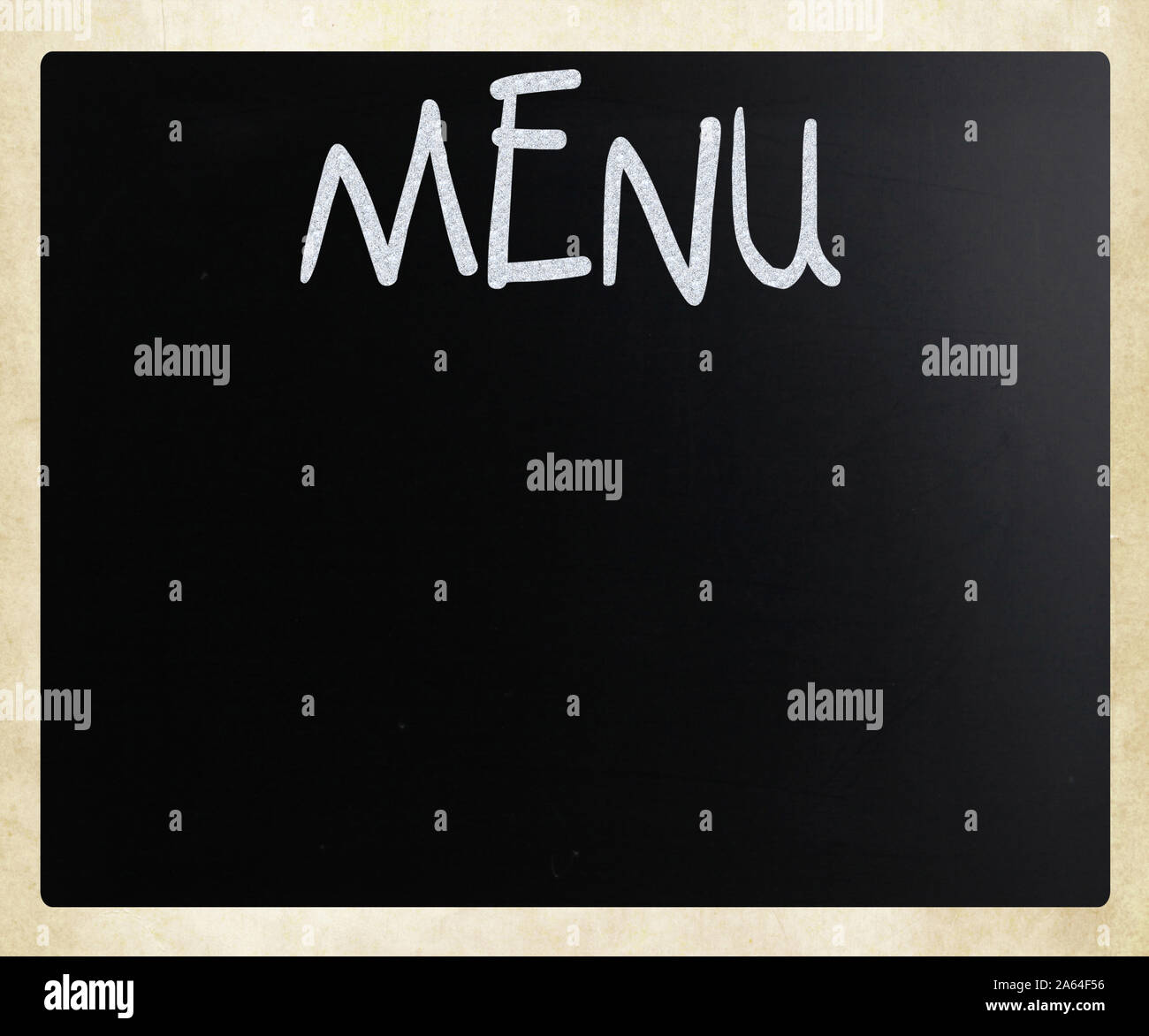 The word "Menu" handwritten with white chalk on a blackboard Stock ...
