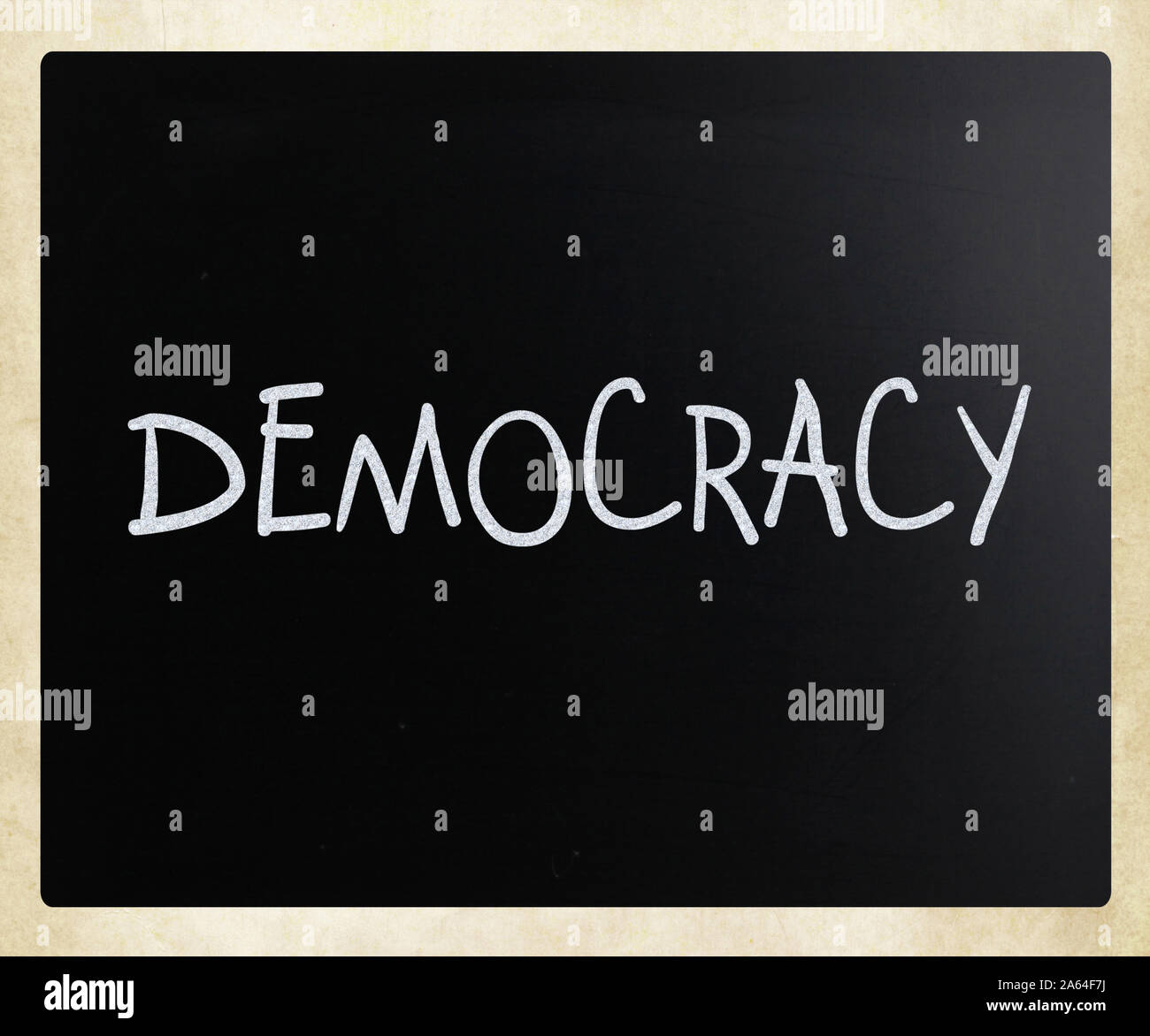The word "Democracy" handwritten with white chalk on a blackboard Stock ...