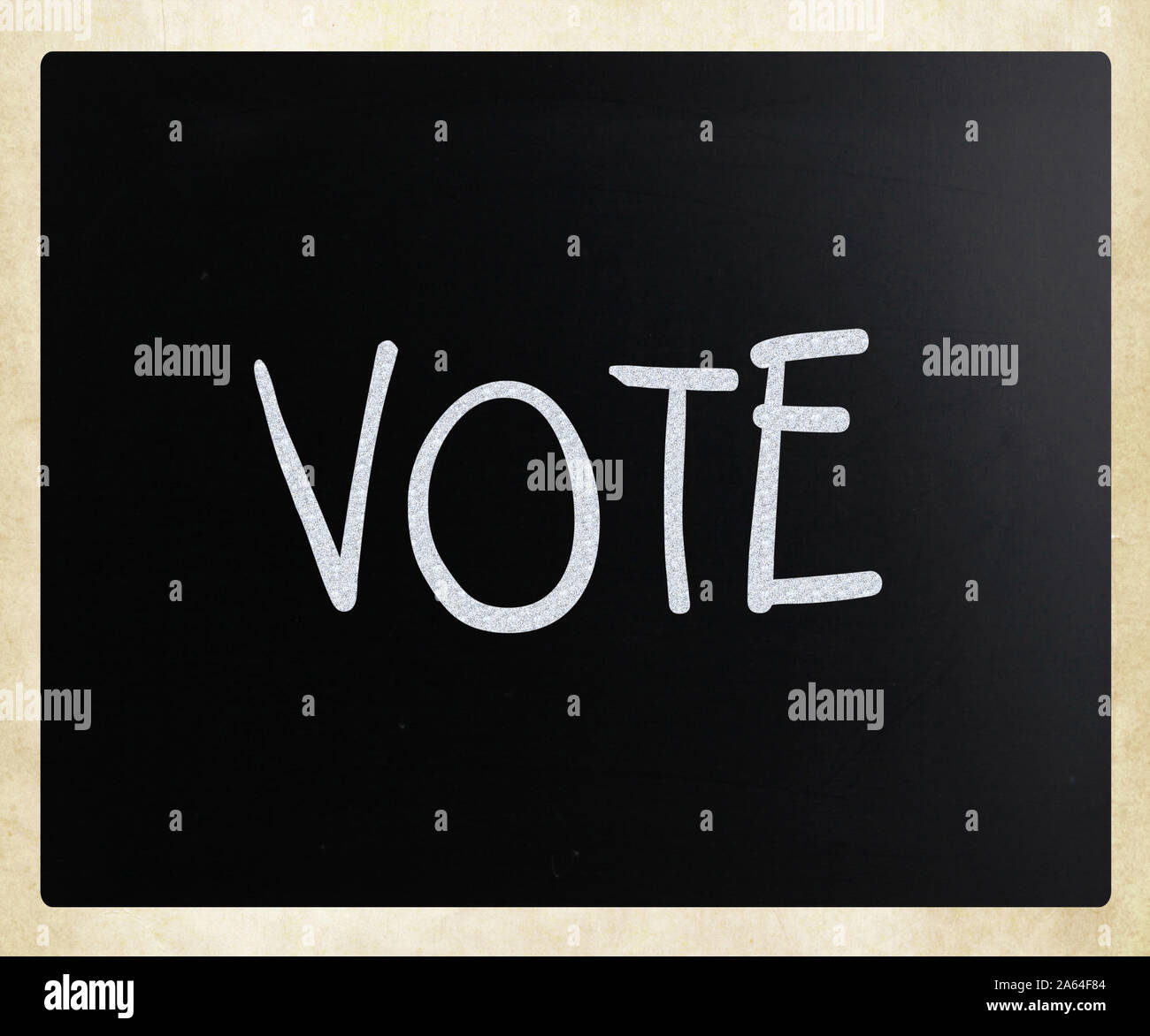 The word 'Vote' handwritten with white chalk on a blackboard Stock ...