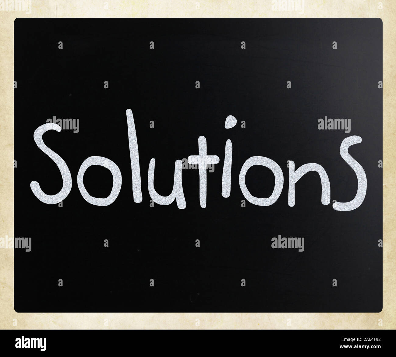 "Solutions" handwritten with white chalk on a blackboard Stock Photo ...