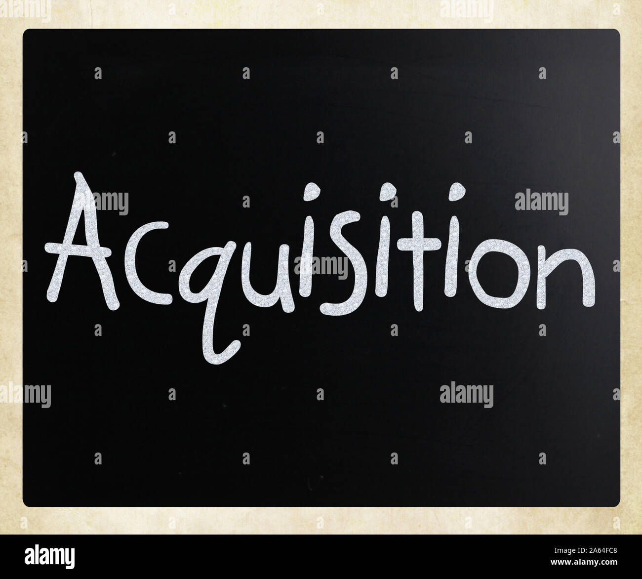 The word "Acquisition" handwritten with white chalk on a blackboard ...