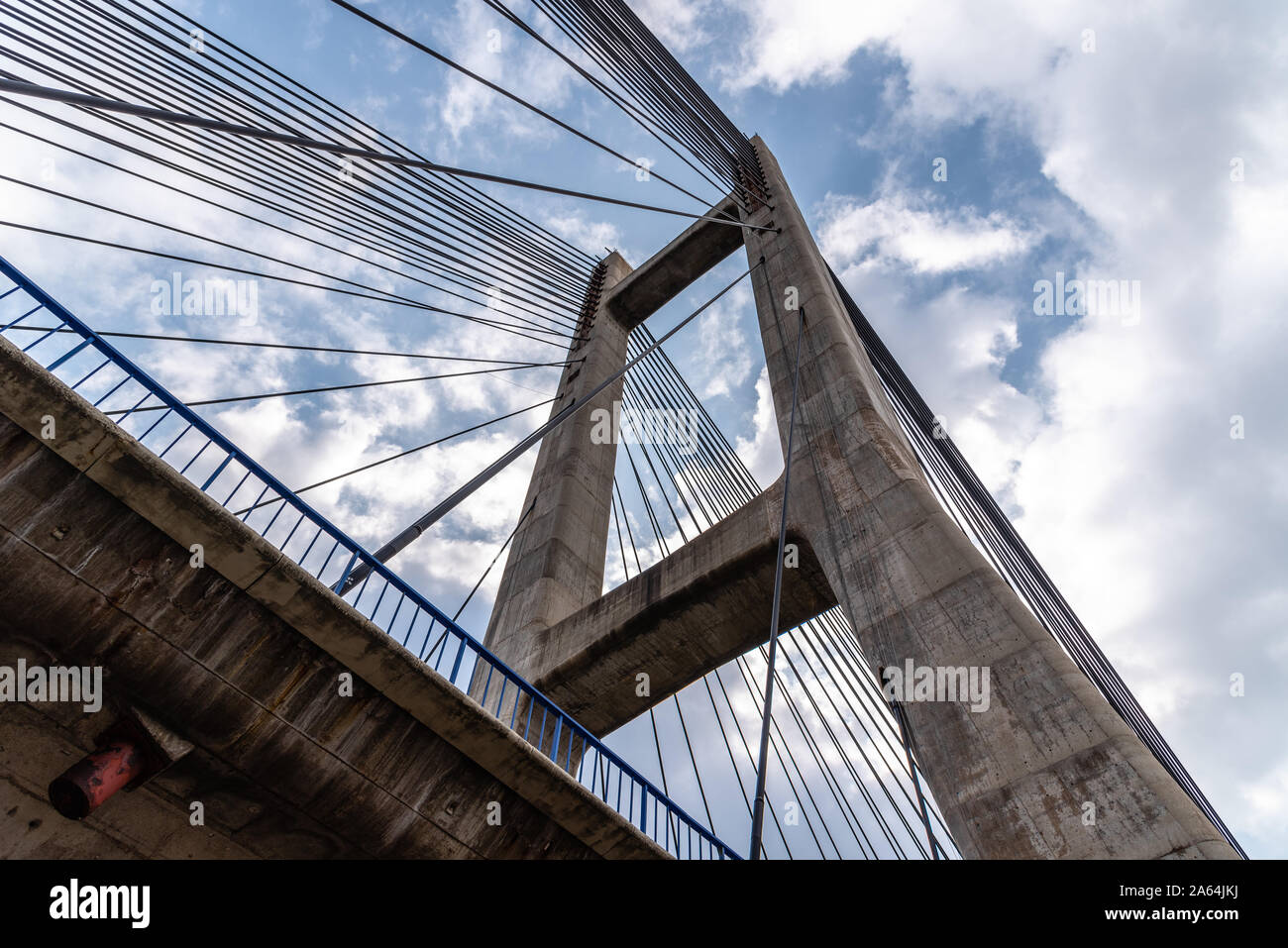 Modern suspension bridge. Detail of tower and steel cables. Barrios de ...
