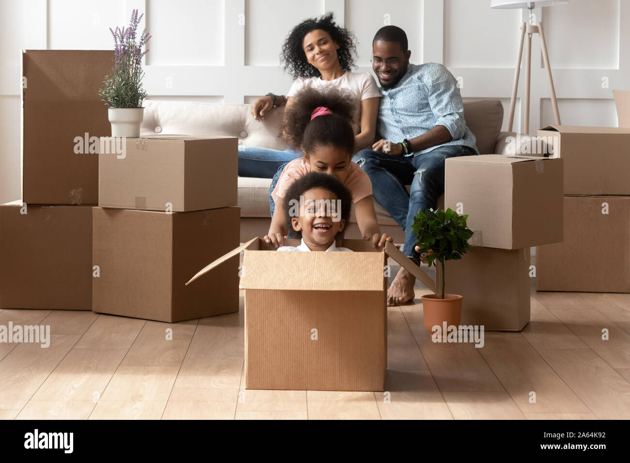 Excited little kids have fun playing on moving day Stock Photo - Alamy