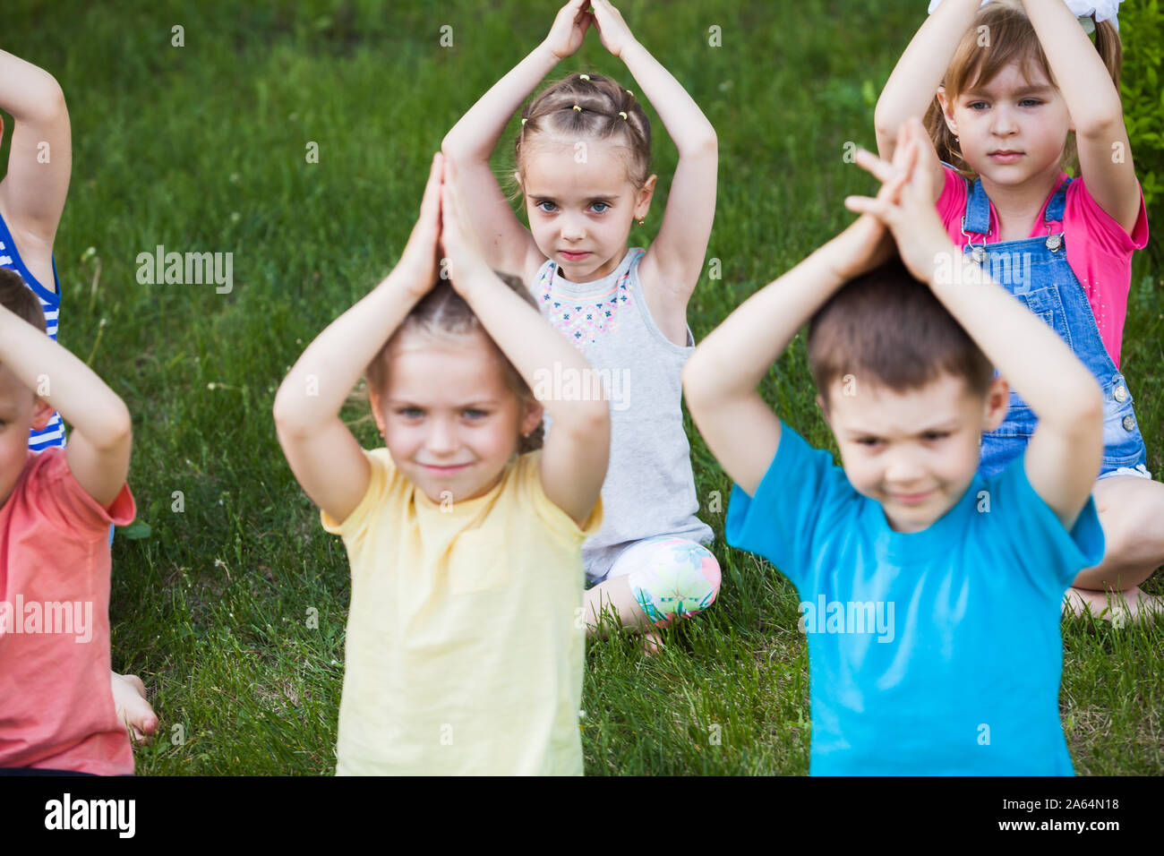 children practicing yoga Stock Photo - Alamy