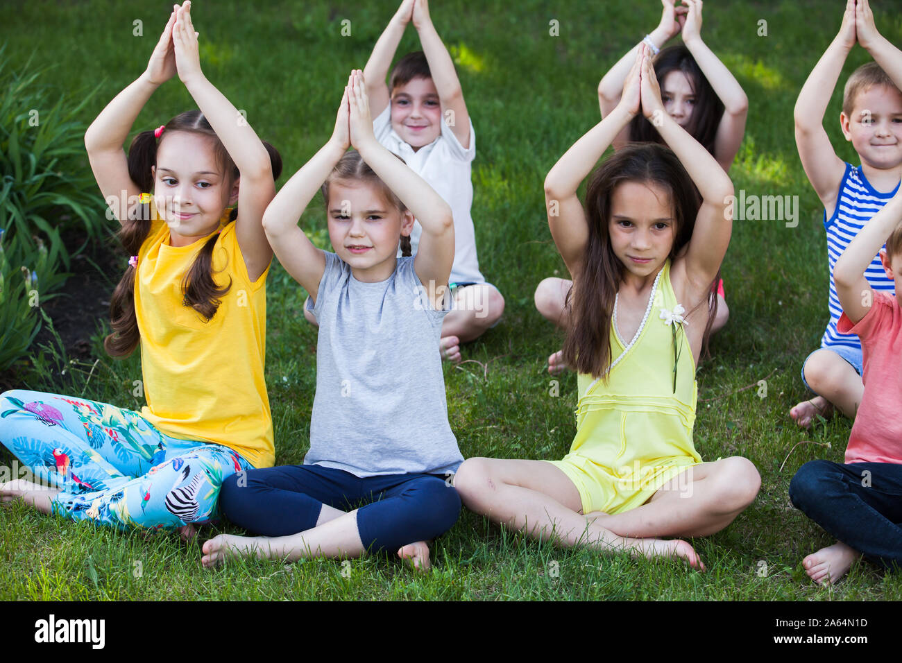 children practicing yoga Stock Photo - Alamy