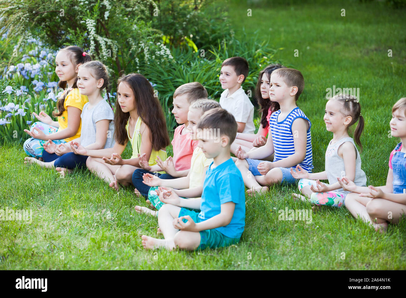 children practicing yoga Stock Photo - Alamy