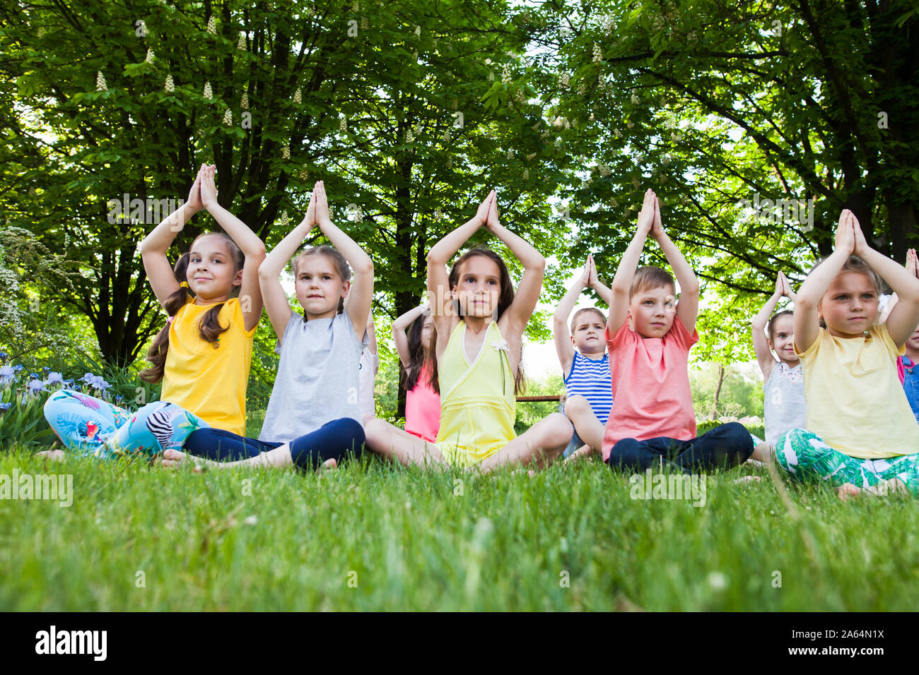 children practicing yoga Stock Photo - Alamy