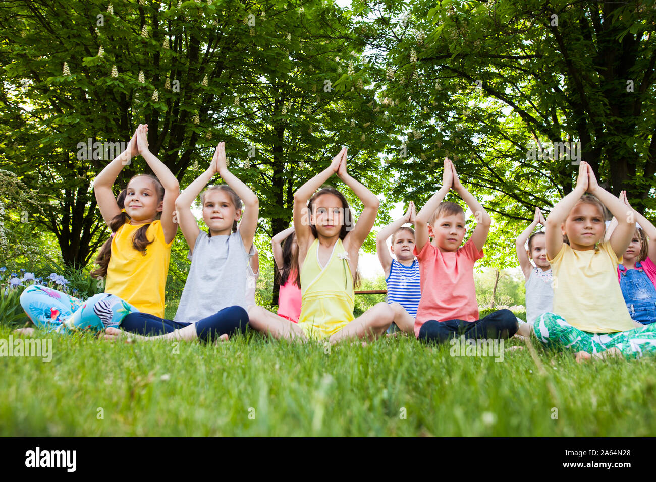children practicing yoga Stock Photo - Alamy