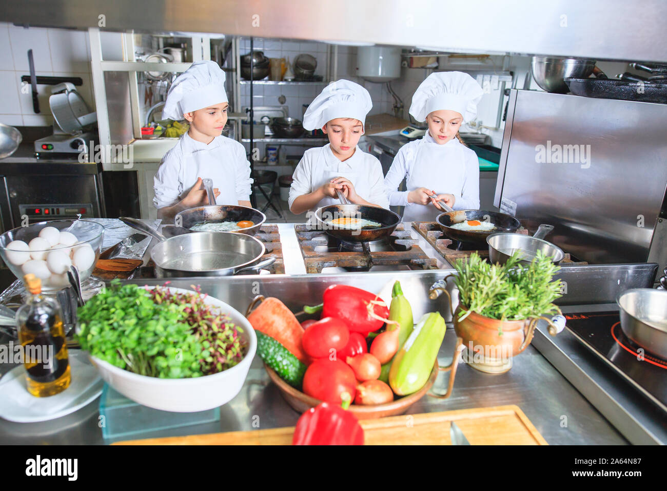 children cooking lunch in a restaurant kitchen Stock Photo - Alamy