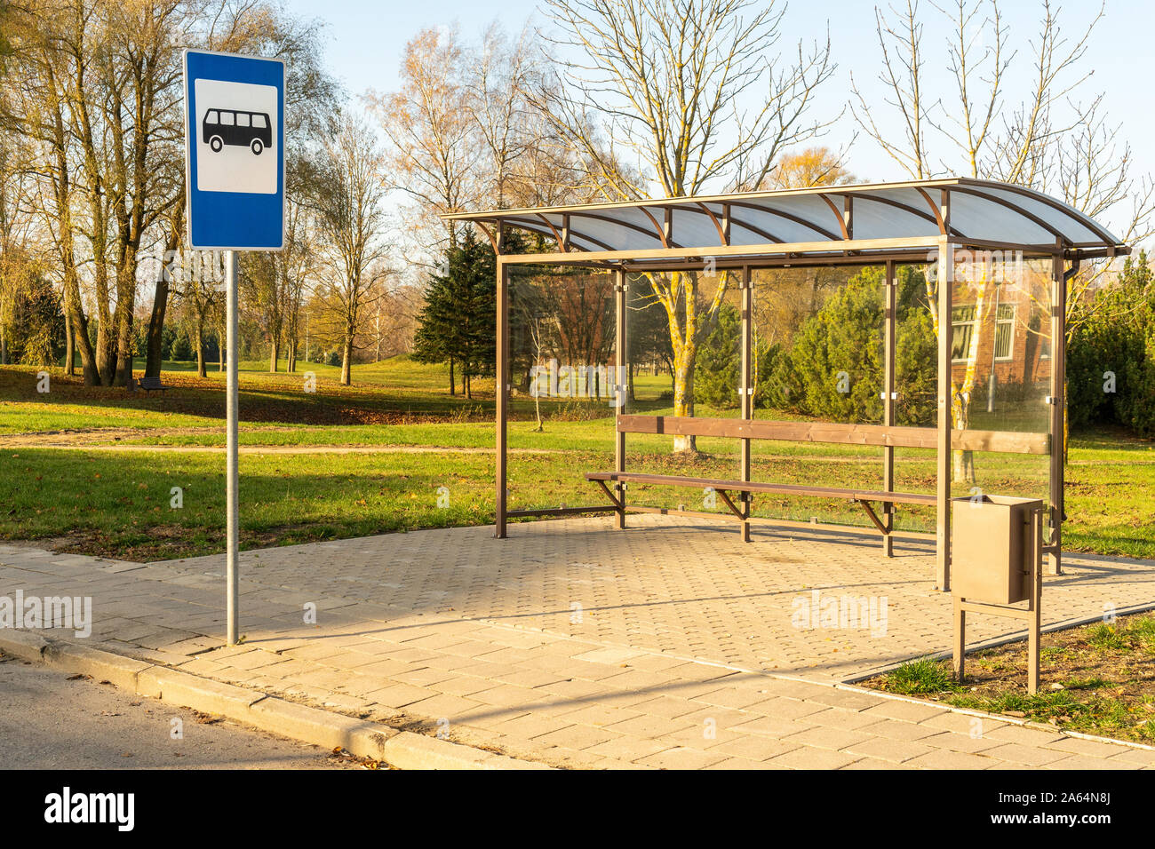 Landscape with empty bus stop in a sunny morning Stock Photo - Alamy