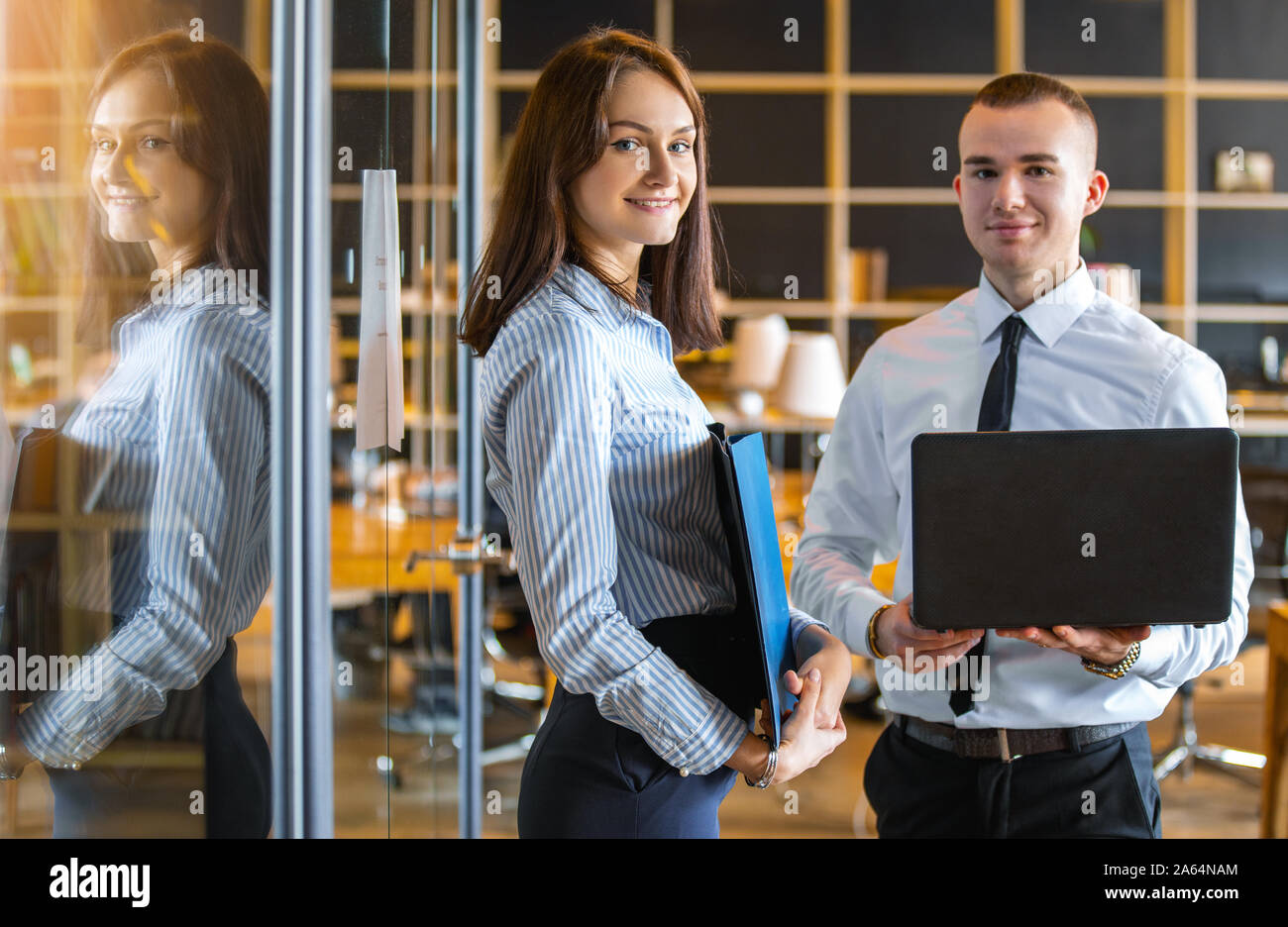 Portrait students holding laptop hi-res stock photography and images ...