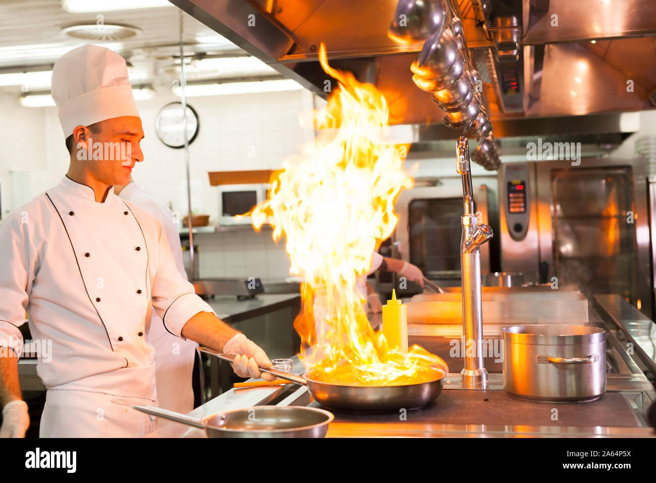 the work of the cook in the kitchen of the restaurant Stock Photo - Alamy