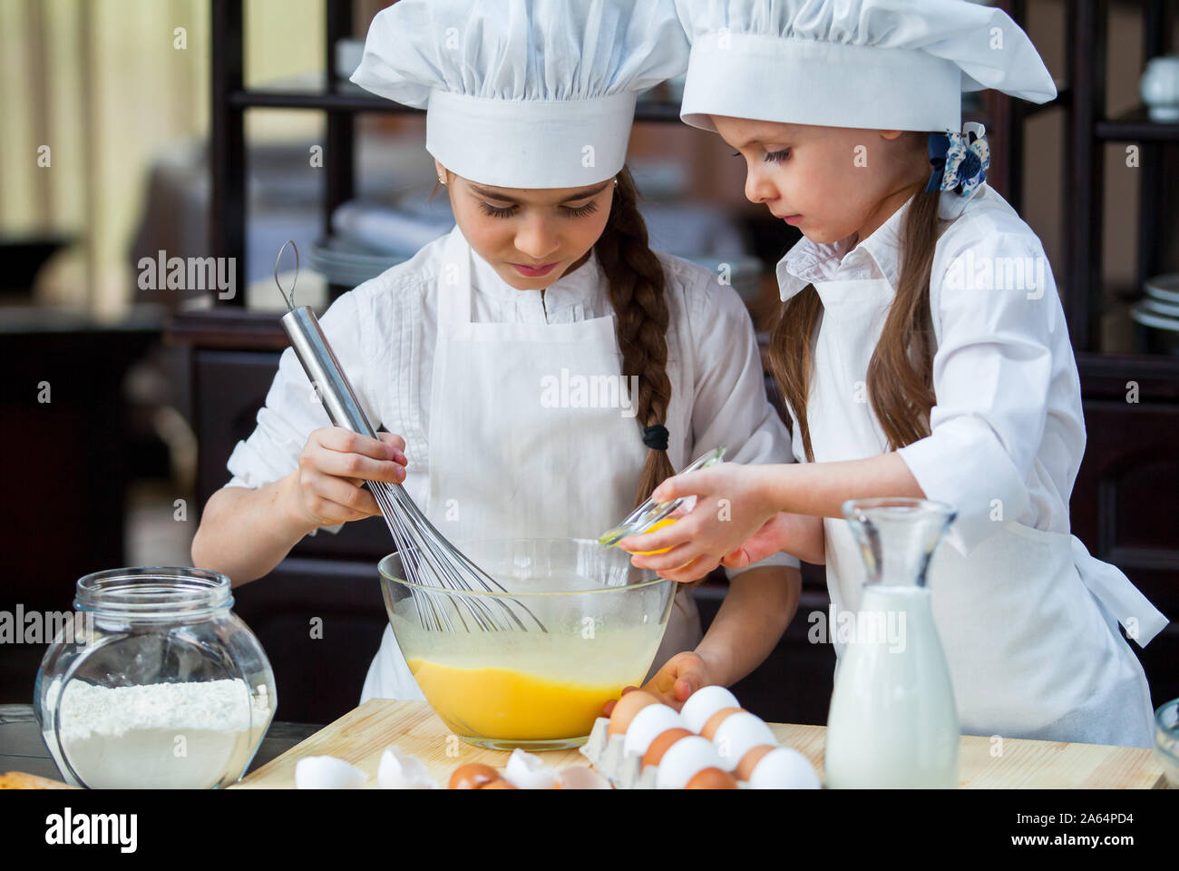 Two pretty girls making food hi-res stock photography and images - Alamy