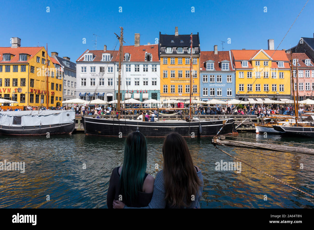 Young pretty girlfriends in love sharing time together at travel trip ...