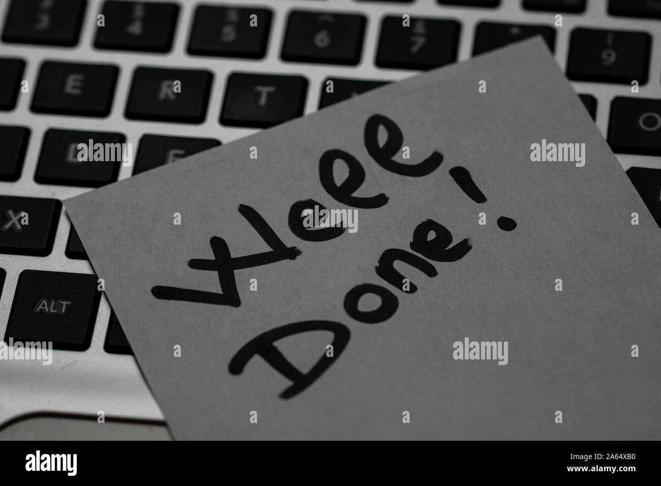 Writing on sticky note Well done! Text with Well done! on paper. Sticky ...