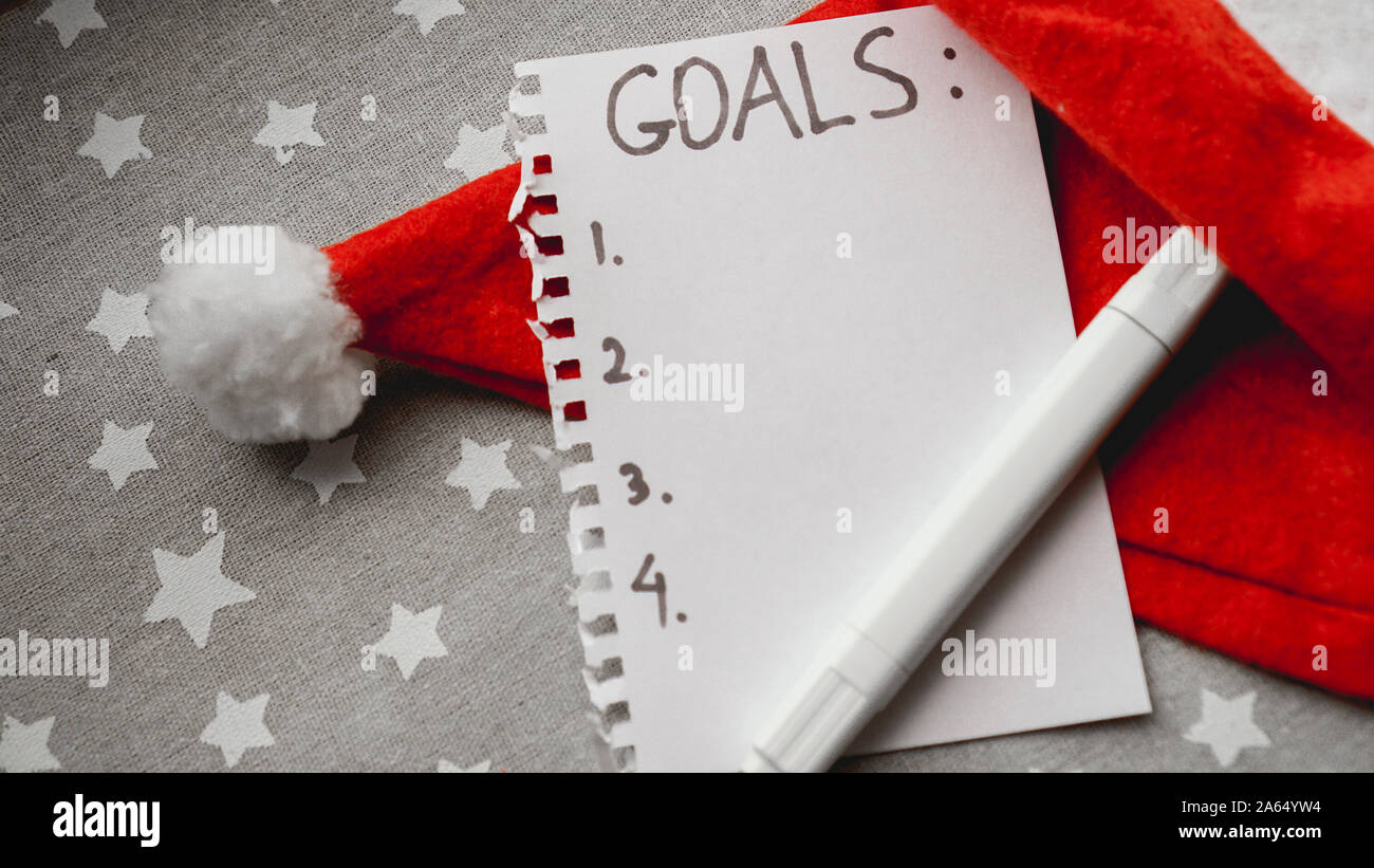 Notebook is with goals text on christmas background Stock Photo - Alamy