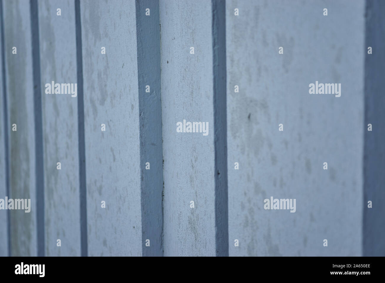 Background image made up of a close up of a modern ribbed concrete wall ...
