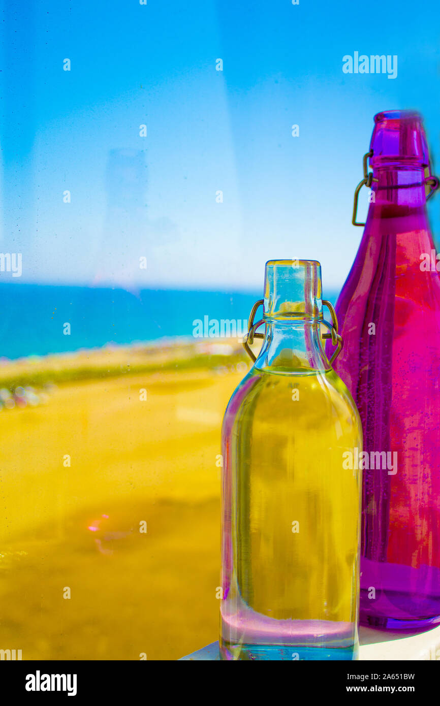 Classic transparent glass bottle with color Stock Photo - Alamy